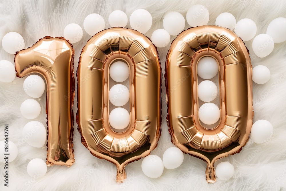 Elegant golden number balloons forming the numeral 100, surrounded by ...