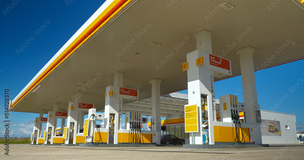 Gas station with full gas pumps to refill empty tanks of vehicles on ...