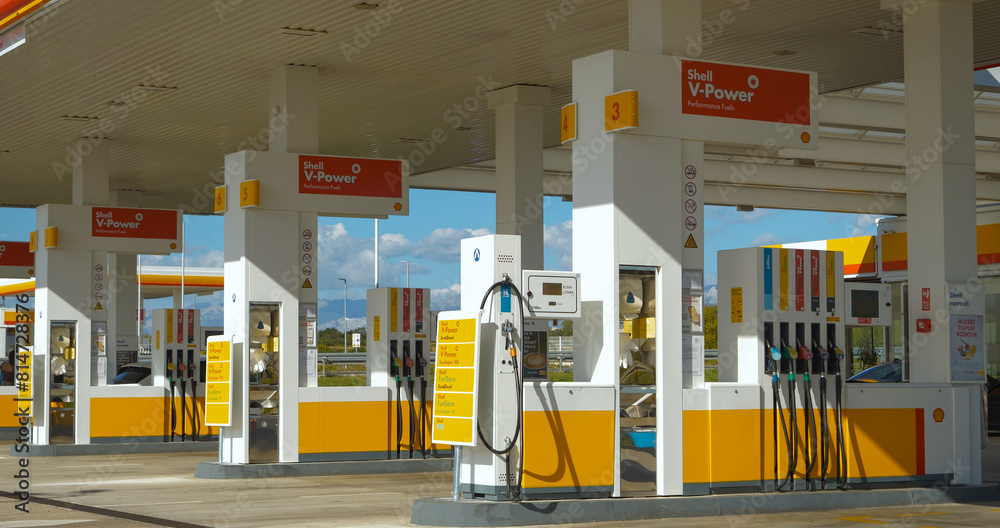 Petrol station with full gas pumps for refuelling empty vehicle tanks ...