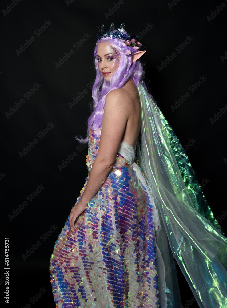 artistic portrait of beautiful female model with long purple hair and ...