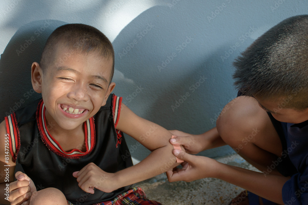 Top-view of two asian young boy smiling cheerfully sitting on the floor ...