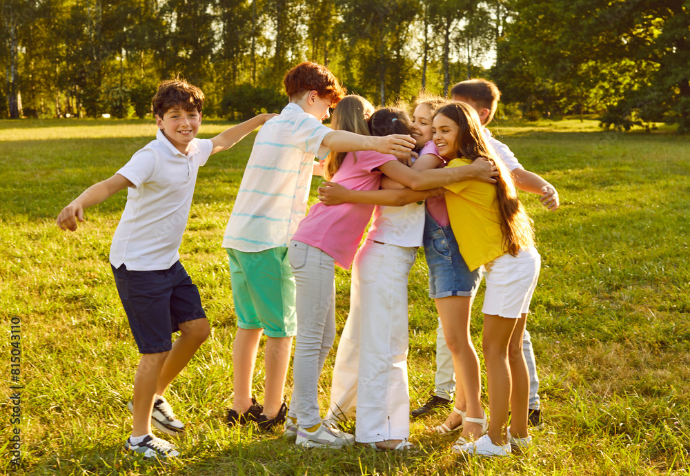 Full length portrait of a funny happy overjoyed kids friends having fun ...