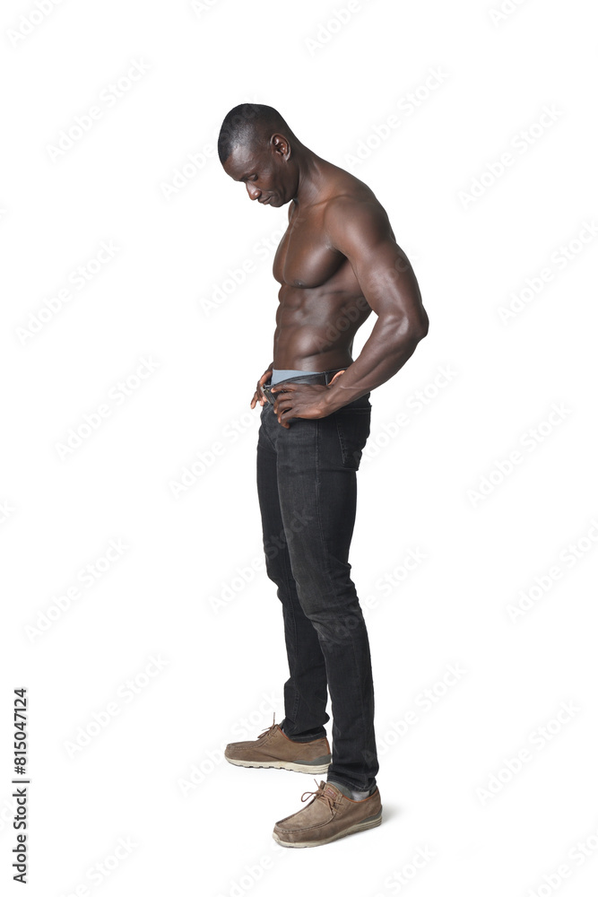 side view of a portrait of shirtless man look down and armas akimbo on ...