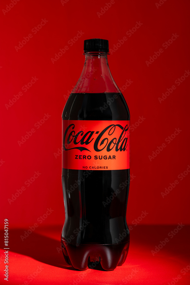 Plastic bottle of Zero Coca-Cola with label and trademark on on red ...
