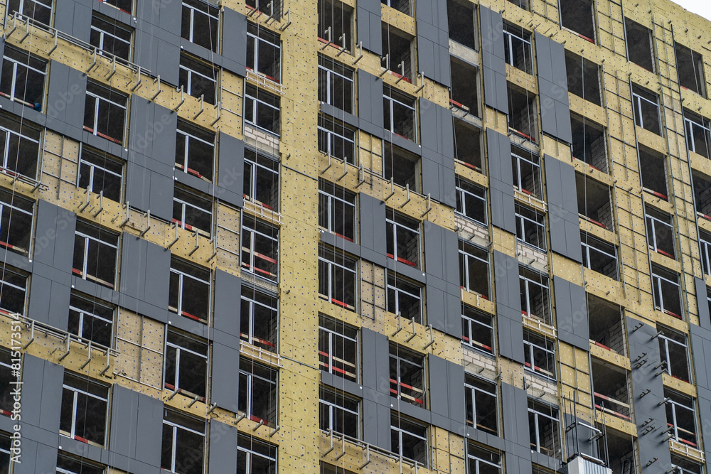 Concrete wall with attached aluminum holders or brackets for heat ...