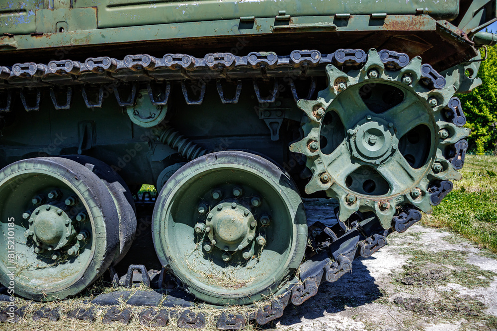 tracks and wheels of tank t80, armored vehicles on the street in green ...