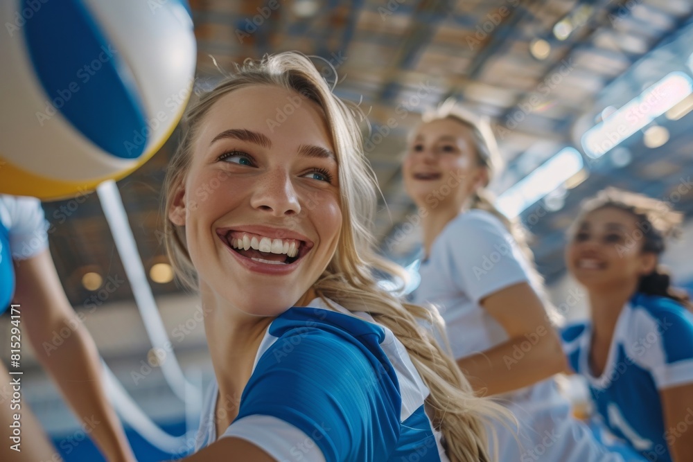 Blonde female volleyball players exhibit teamwork and joy as they work ...