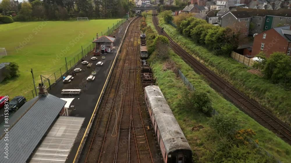 Aerial of a vintage railway station in Whitehead, Northern Ireland. The ...