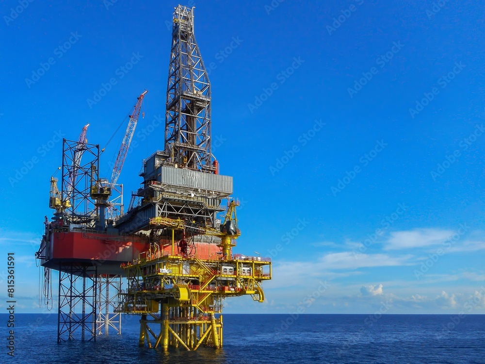 Drilling rig offshore oil field showing derrick, drill floor, crane ...