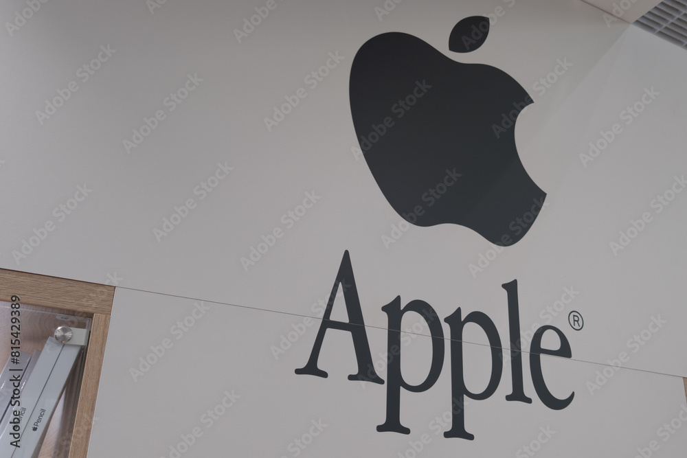 Apple logo brand and chain sign text on facade store entrance chain ...