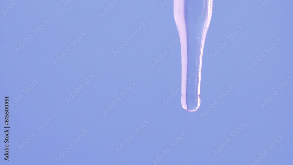 Macro video of dropper & beaker on plain background. Close up of ...