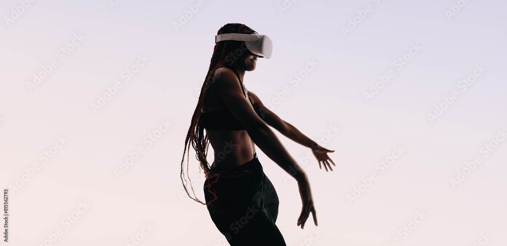 Happy woman celebrating with immersive vr dance moves in a virtual ...