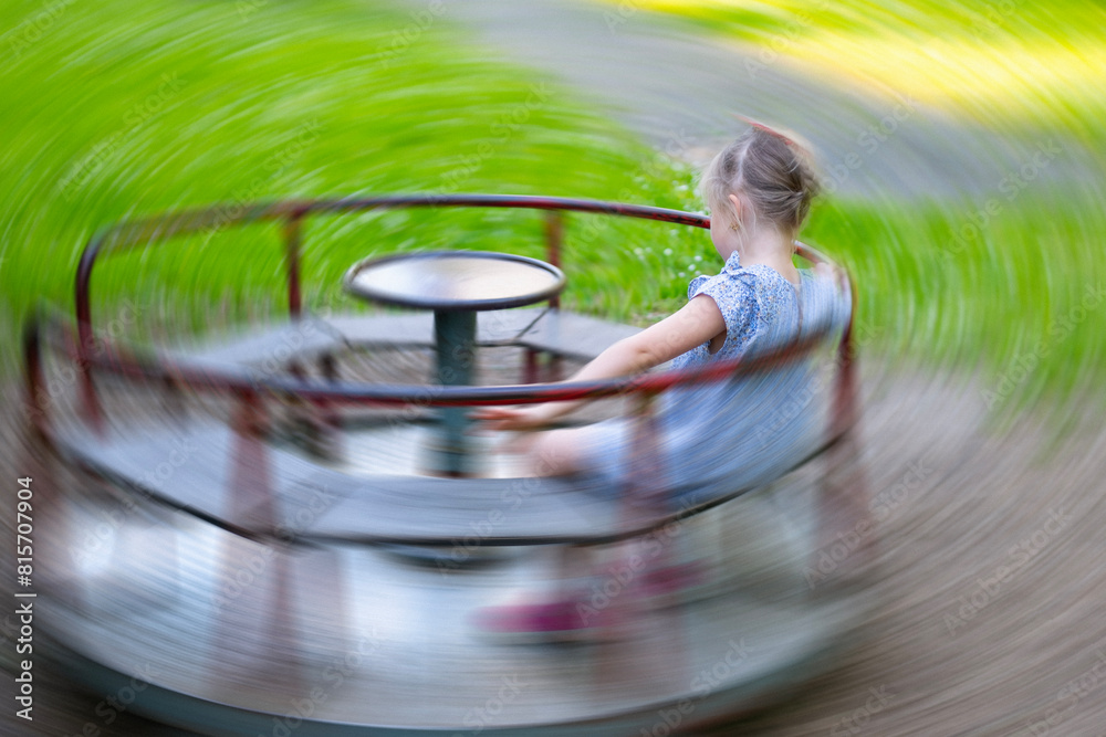 dizziness and balance, preschool girl, child spinning on carousel on ...