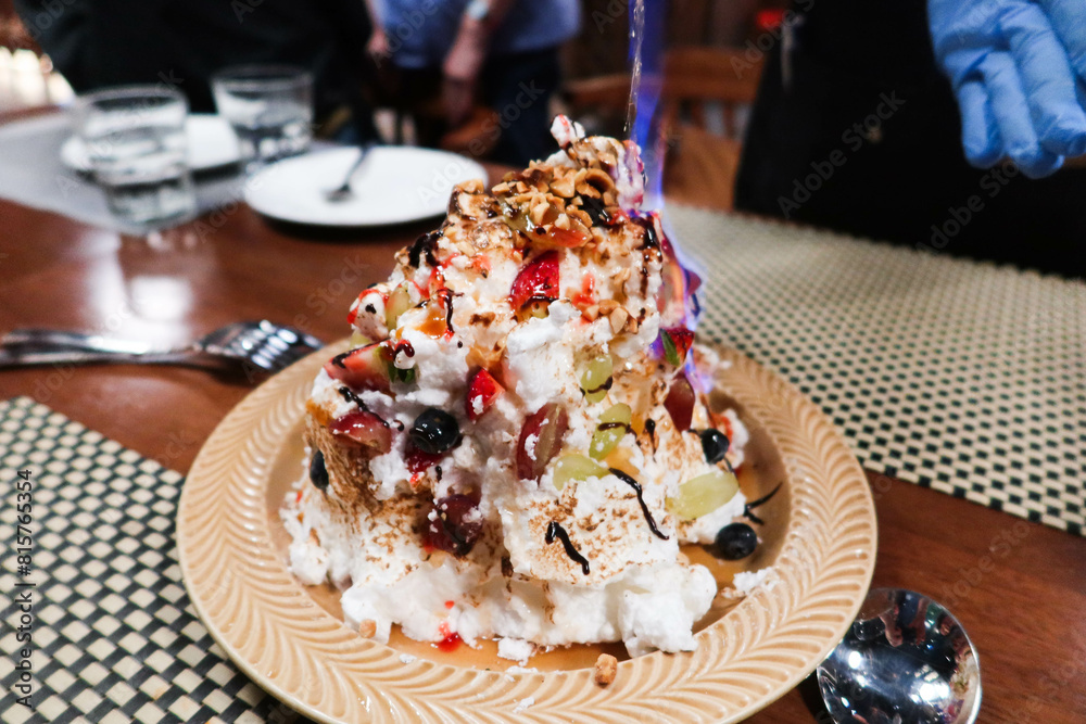 baked Alaska, a swiss desert with cream, ice cream, cake and fruit ...