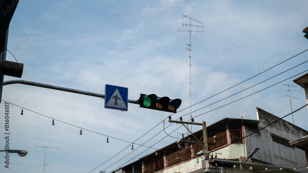 Pedestrian traffic crossing light in green signal at the urban city ...