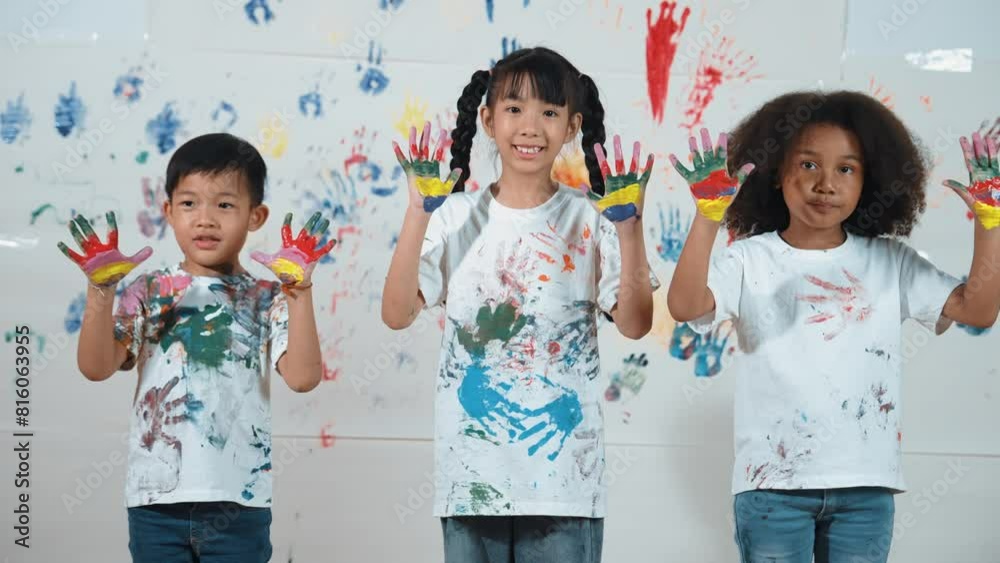 Vidéo Stock Diverse students put hand up together show colorful stained ...