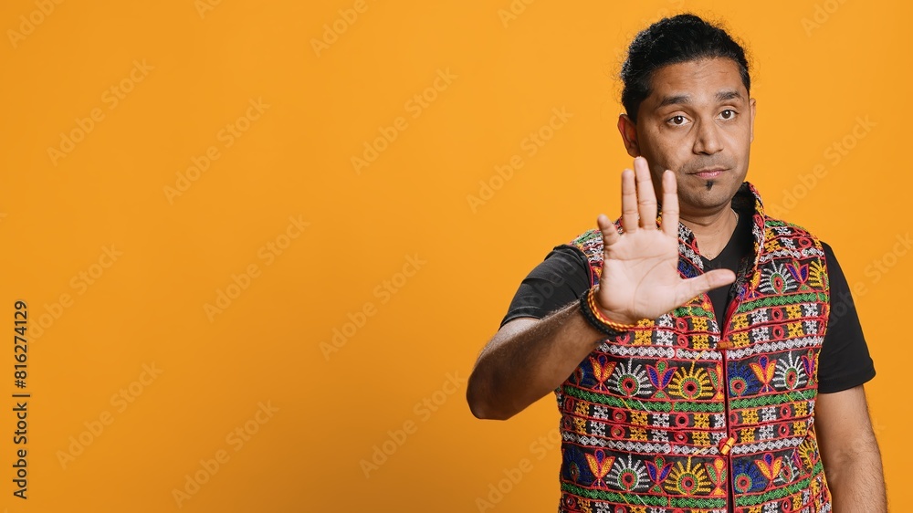 Stern indian man doing stop hand gesture sign, complaining ...
