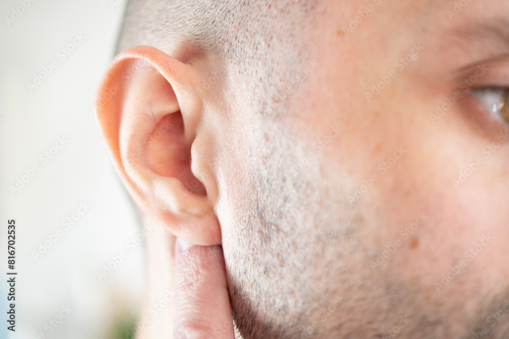caucasian young man holding painful ear close up, hearing loss, Ear ...