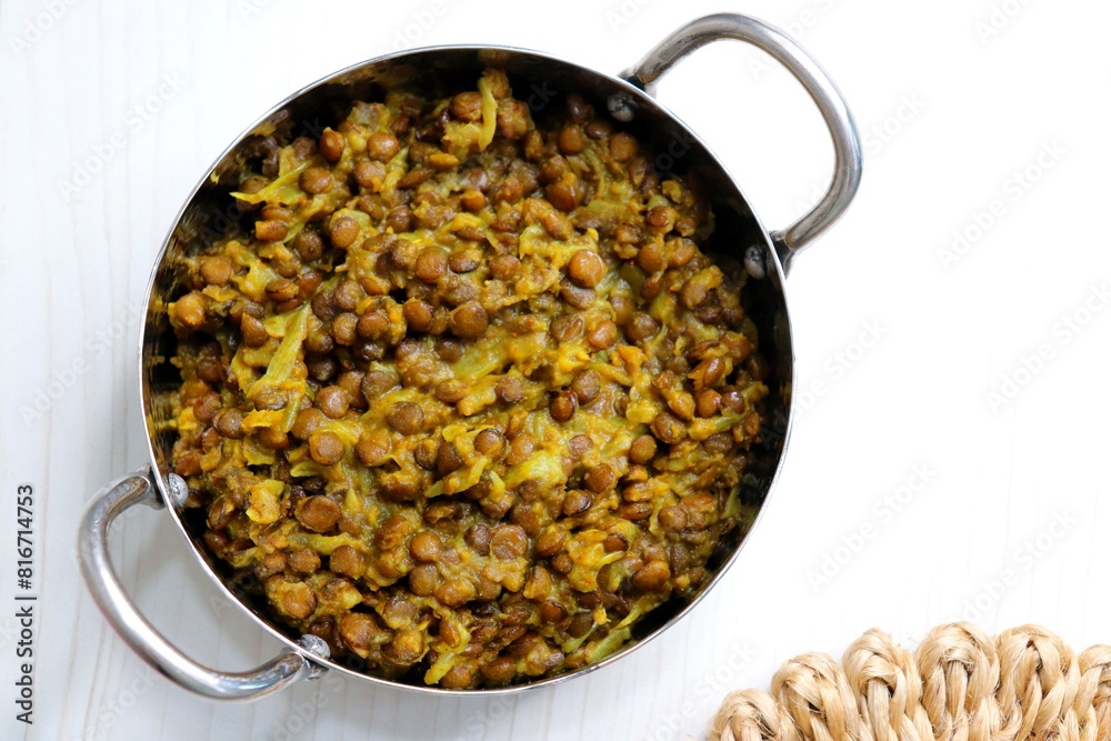 Akkha Masoor is an Indian dish cooked with whole red lentils, spices ...