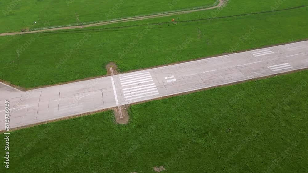 Aerial footage of rural airport runway taxiway and ramp. Airfield ...