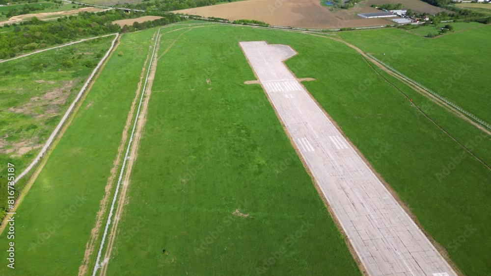 Aerial footage of rural airport runway taxiway and ramp. Airfield ...