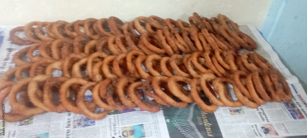 Typical nepali food sell roti (oil fried rings of rice flour) Stock ...