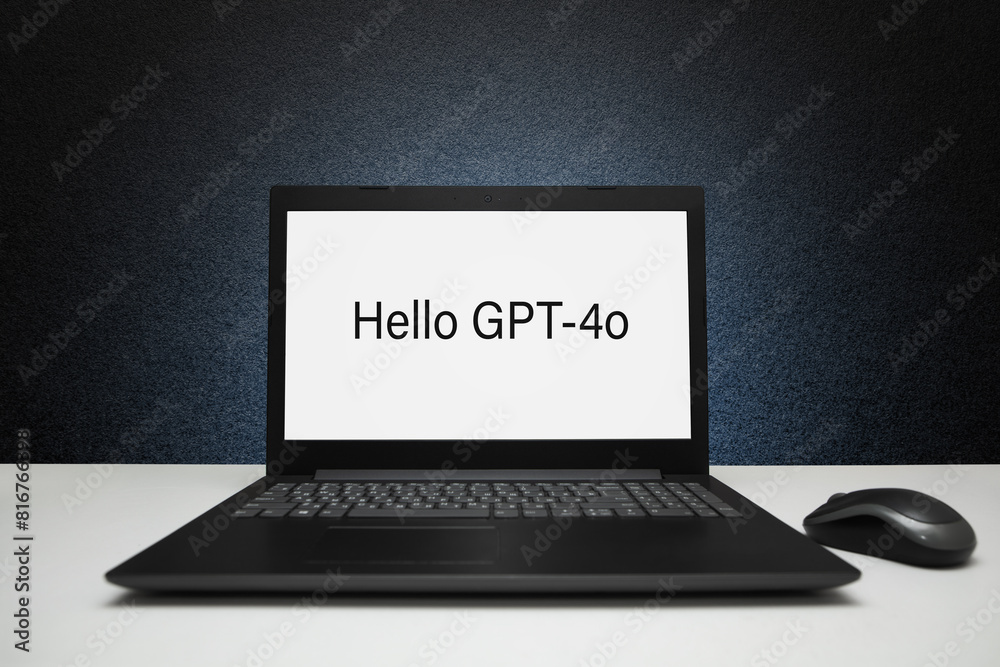 GPT-4o logo on screen laptop computer on black textured wall ...