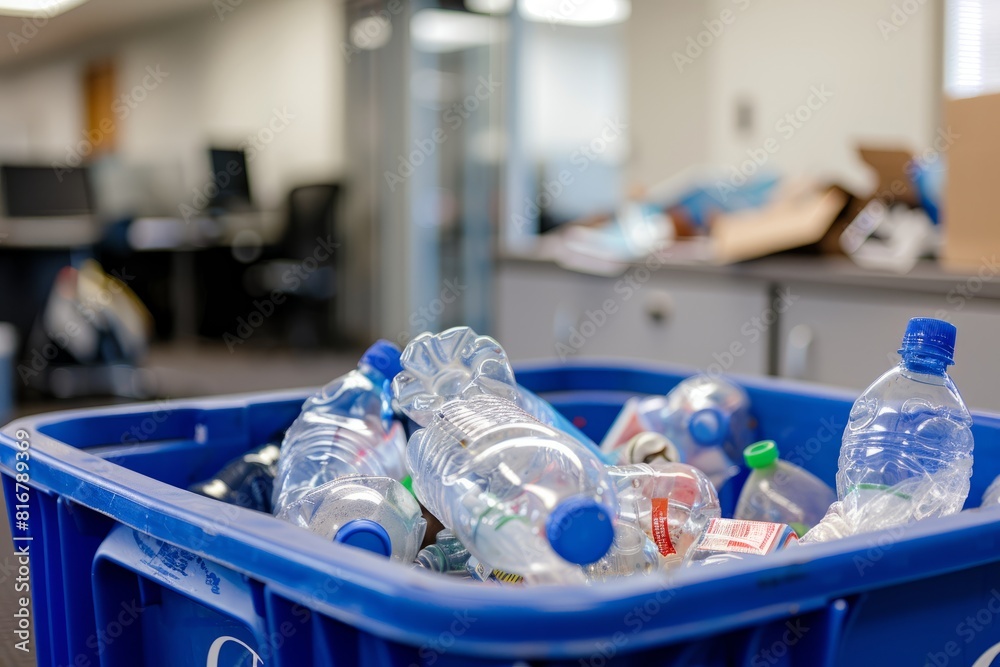 Foto de Blue plastic container filled with water bottles, recycling bin ...