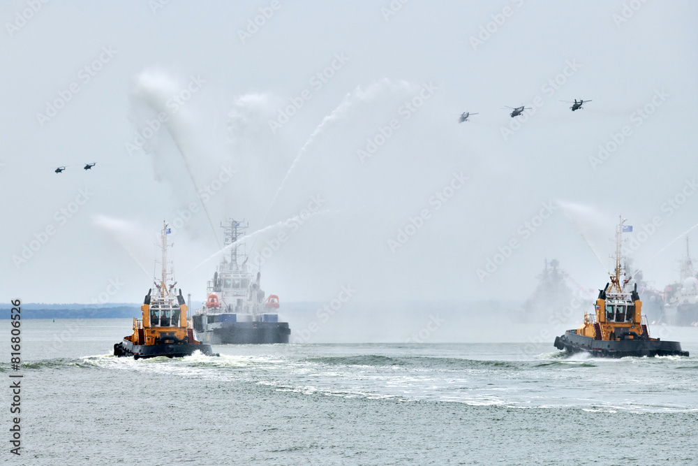 Fireboat sailing along Russian naval forces parade warships with ...
