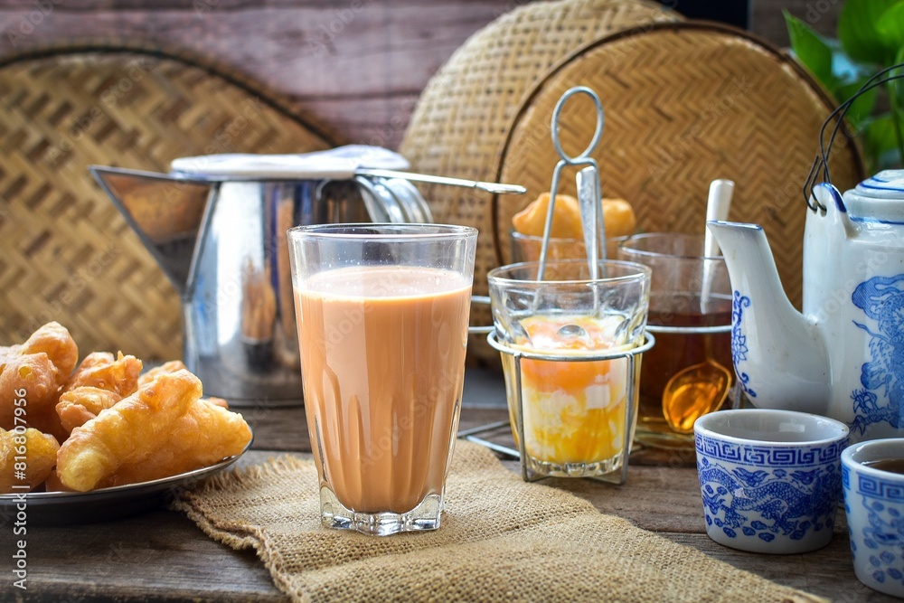 Thai traditional Breakfast set hot milk tea with hot tea and deep fried ...