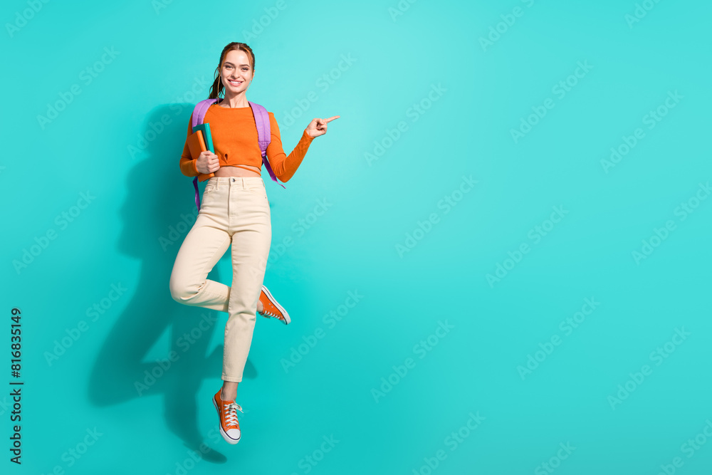 Full Size Photo Of Smart Girl Dressed Orange Shirt Backpack Hold Book