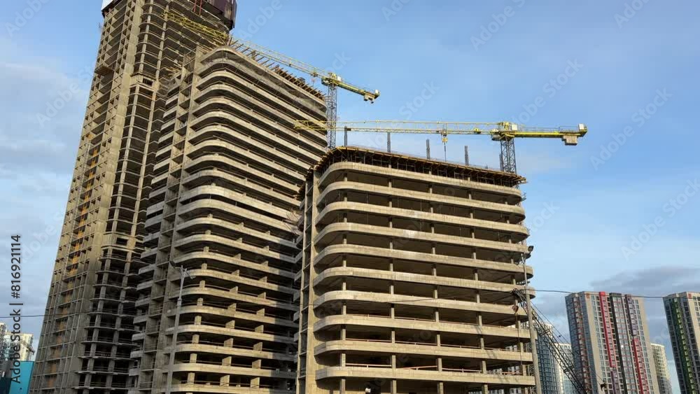 Construction site with buildings under construction. Tower cranes in ...