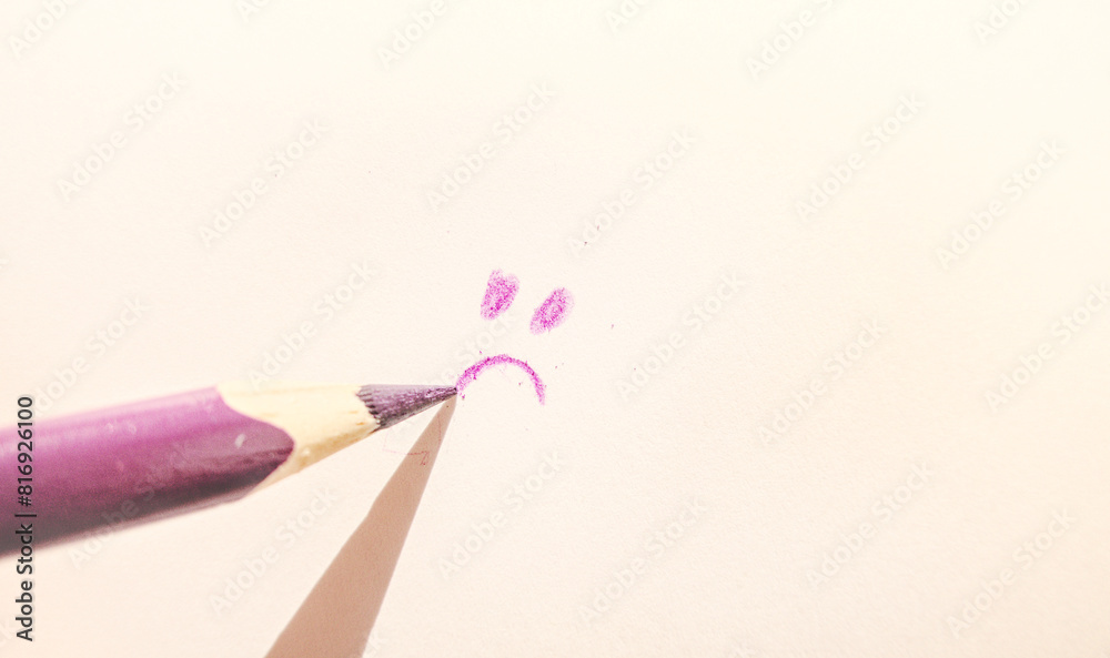 Hand drawn pencil sad face on white paper as illustration of depression ...
