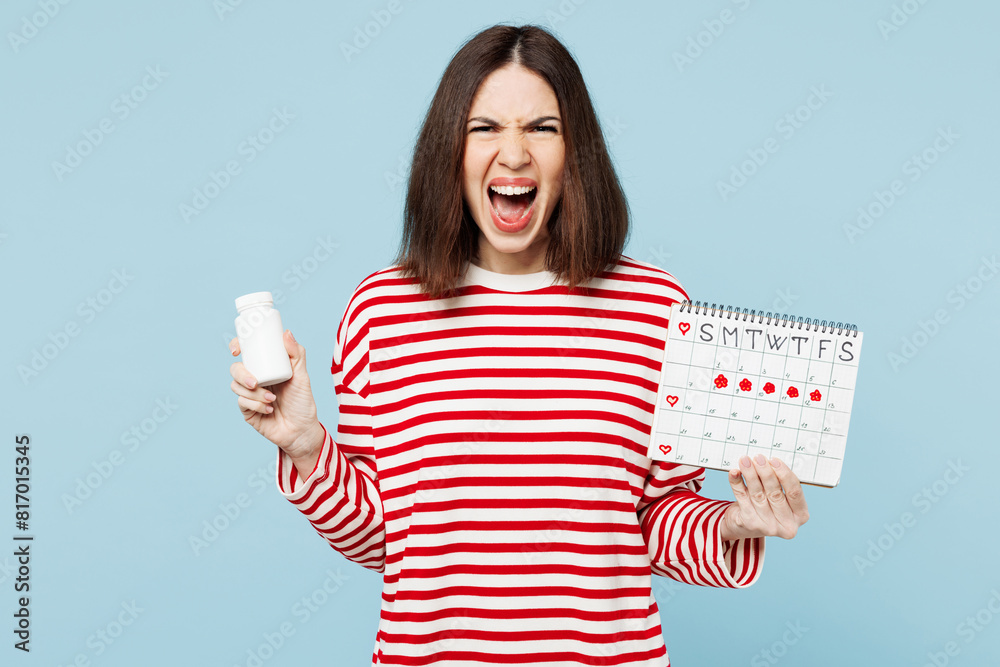 Young angry woman wear red casual clothes hold female periods pms ...