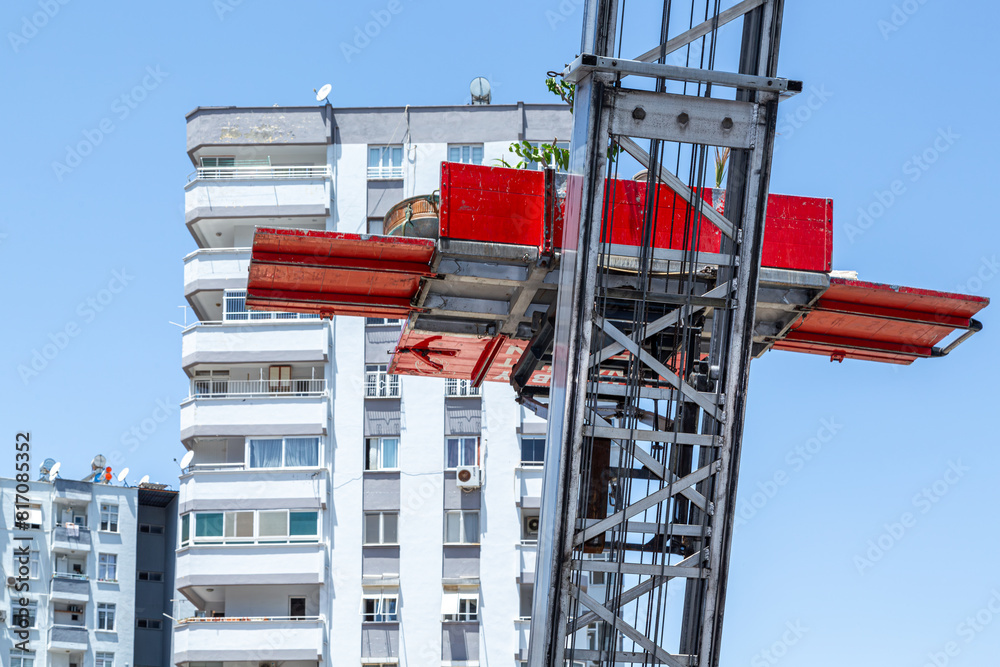 Transporting household goods by elevator to high-rise buildings by ...