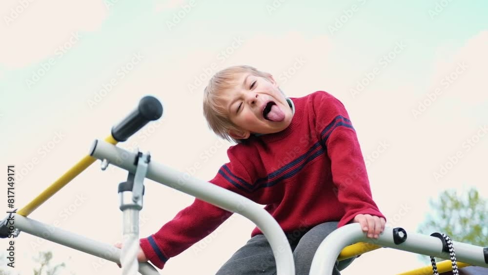 Boy joking, sticking tongue out with silly expression. Child making ...