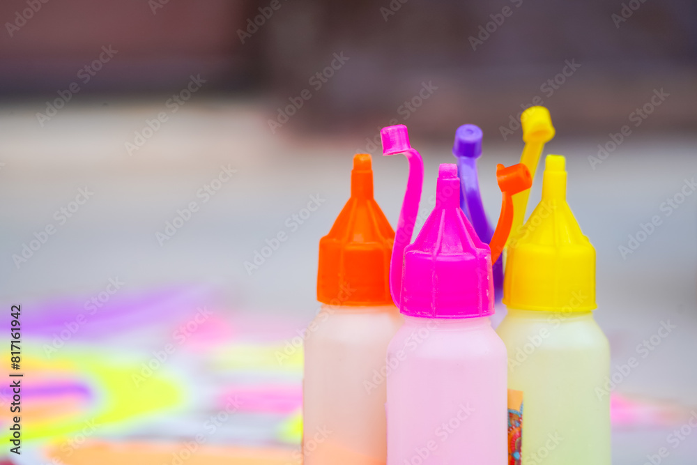 bottle of color powder used to make a rangoli a traditional art made on ...