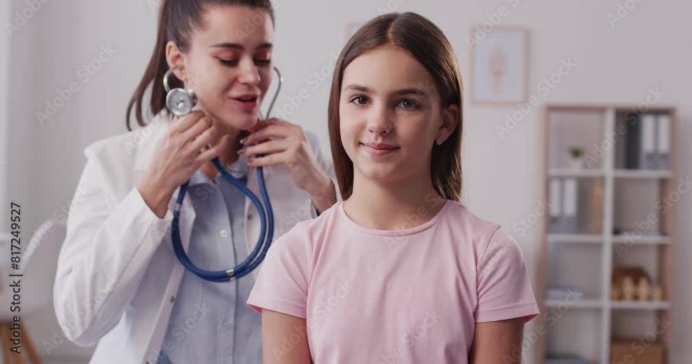 In children hospital pediatrician woman employs stethoscope to ...