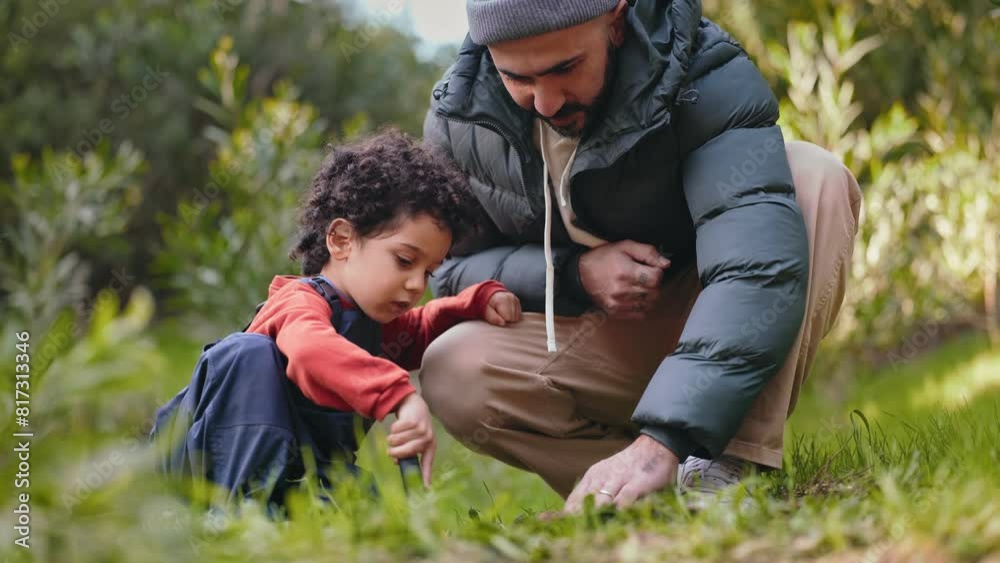Caring dad teaching his young kid how to plant a tree in the backyard ...