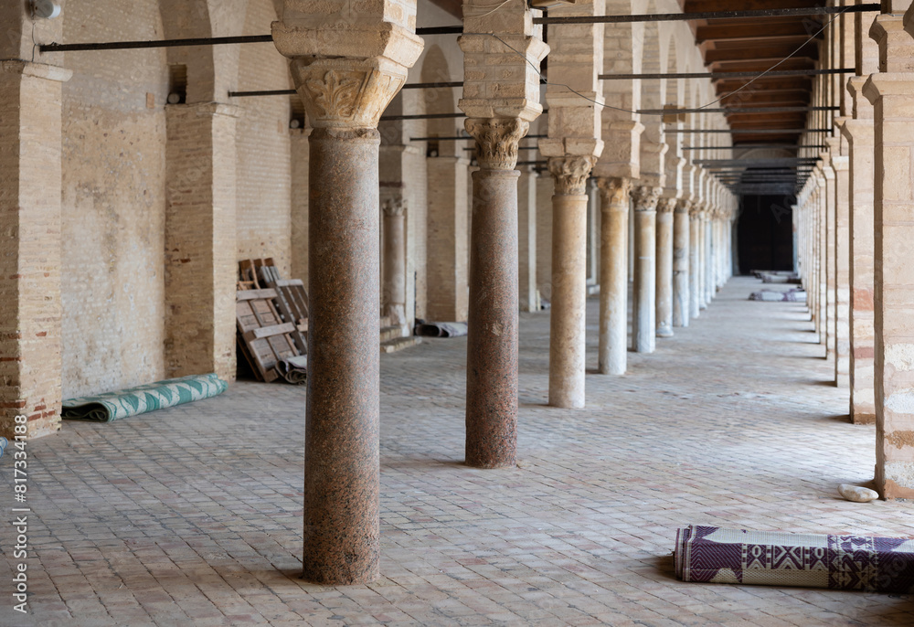 Long corridors under vaulted ceiling in ancient mosque of Kairouan in ...