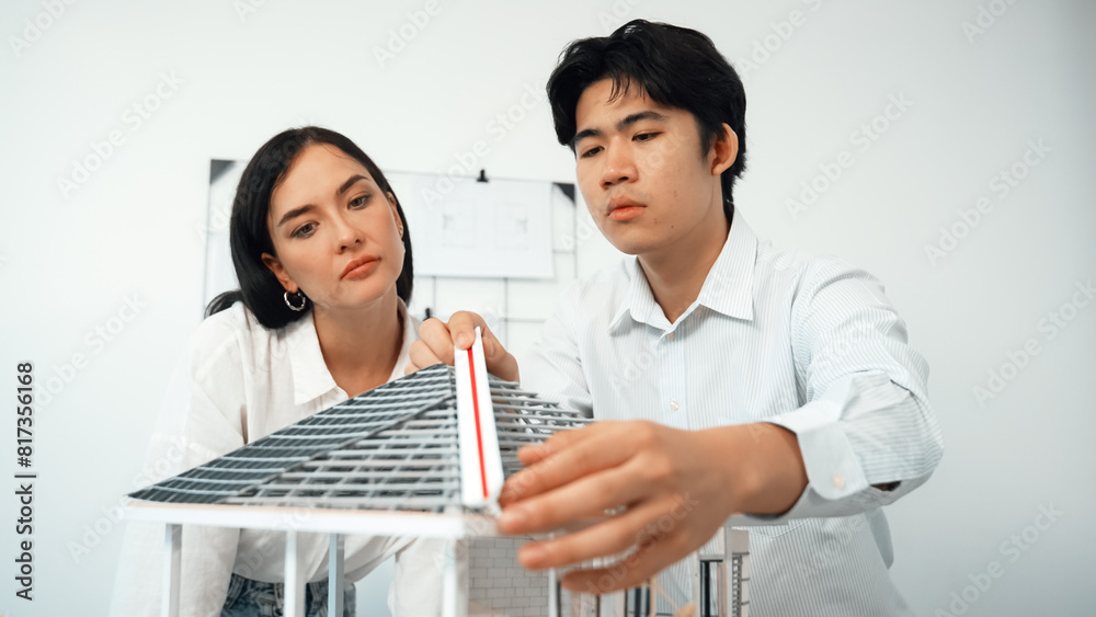 Professional young beautiful architect engineer using ruler and pencil ...