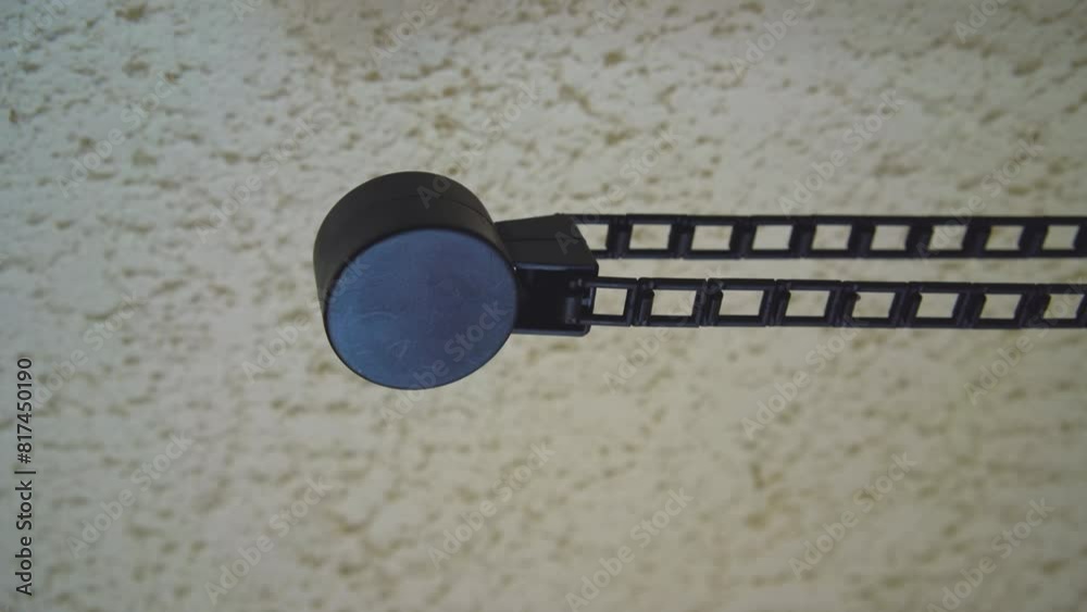 Vertical video. Counterweights on plastic chain for Photography roller ...