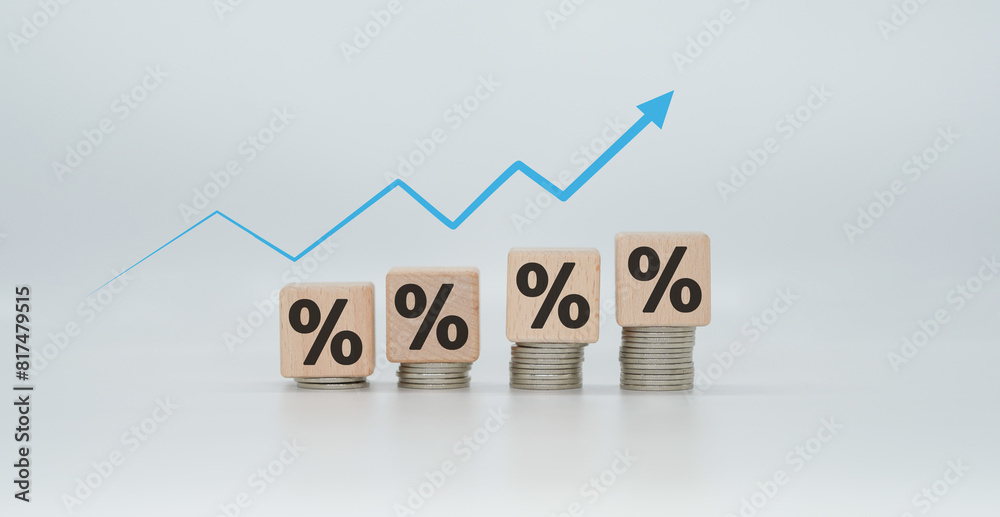 Interest rate concept Wooden block with percentage sign and increasing ...