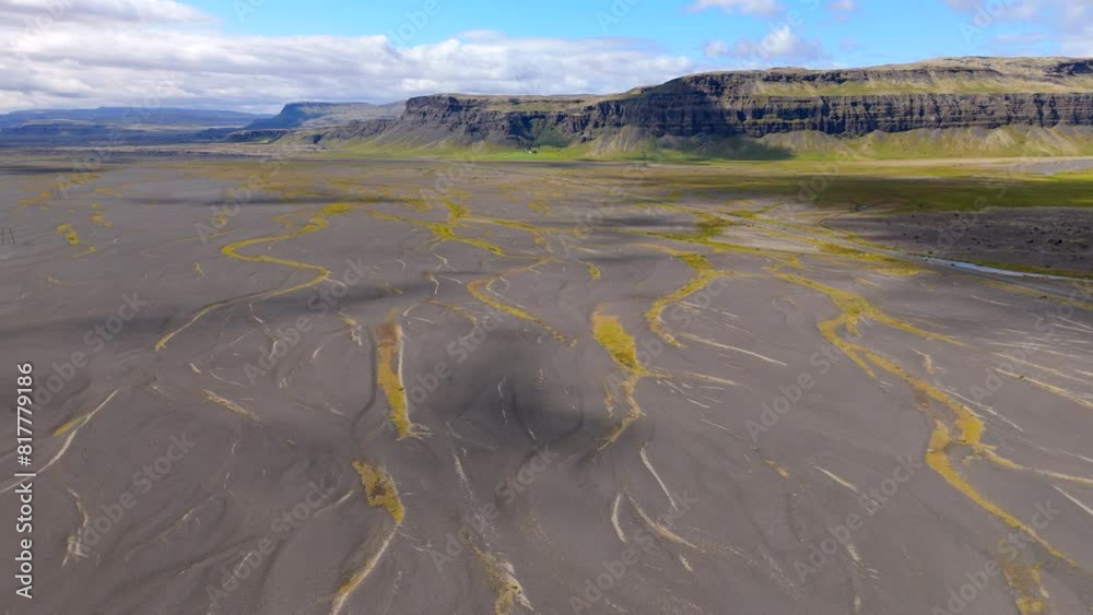 An expansive aerial view of an Icelandic plateau with rugged terrain ...