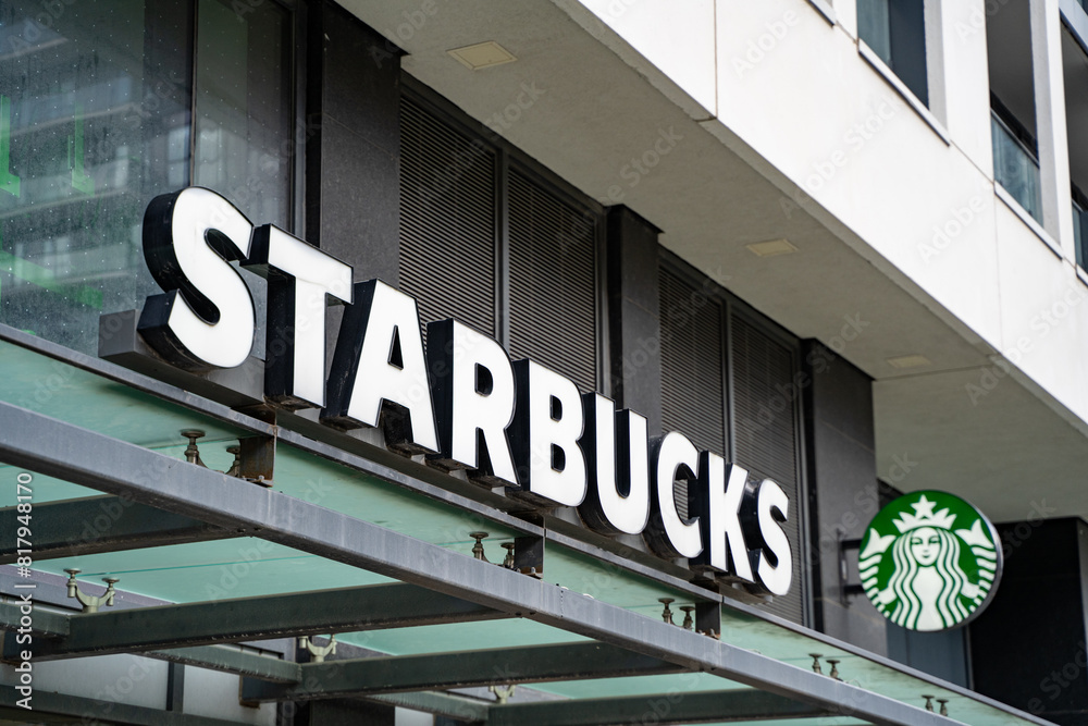 Starbucks logo sign. Starbucks Corporation is an American multinational ...