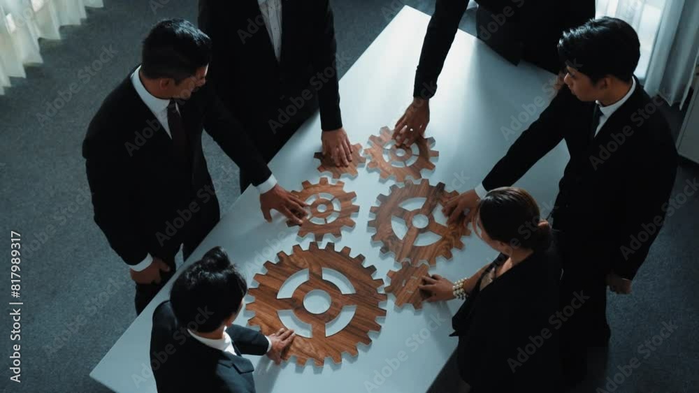 Top view of smart business people gather wooden cog together at meeting ...