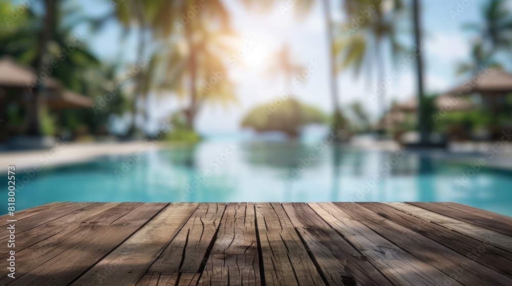 Image of wood table in front of swimming pool blur background. Brown ...