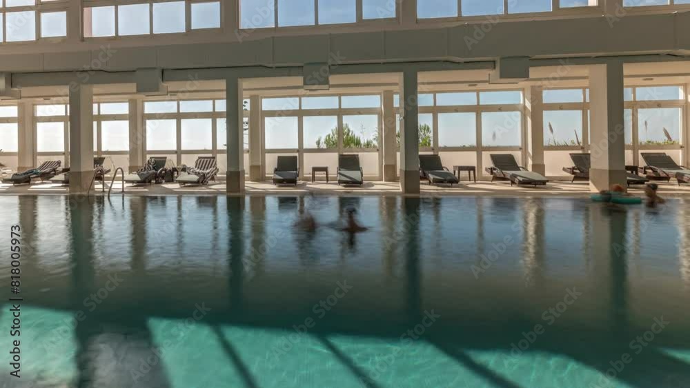Panorama showing luxury indoor swimming pool, part of hotel spa zone ...