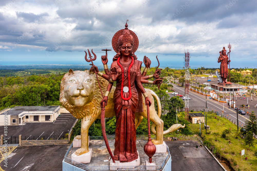 A powerful Statue of the Hindu goddess Durga Maa with a golden lion in ...