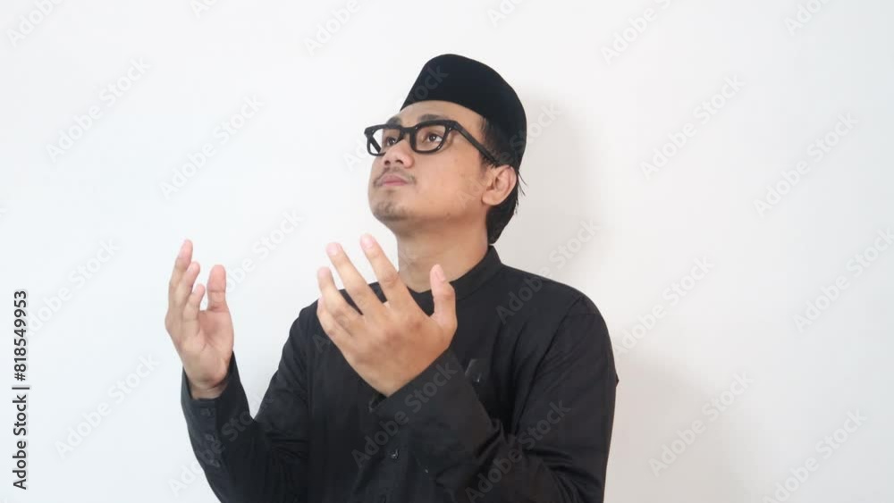 Footage of a Handsome young Asian Muslim man in Arabic costume standing ...